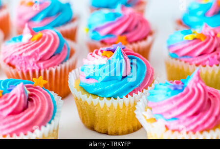 Unicorn theme vanilla cupcakes for kids birthday party Stock Photo - Alamy