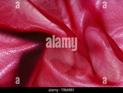 Closeup of ripples in red silk fabric Stock Photo - Alamy