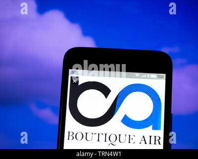 In this photo illustration the Boutique Air logo is seen displayed on a ...