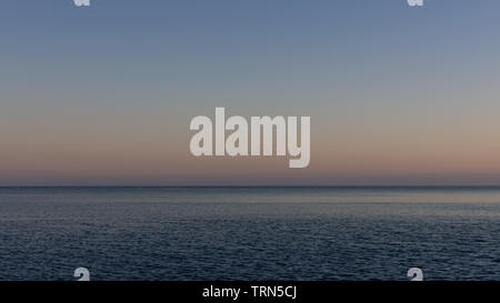 Quiet cozy evening at sea, purple sunset on the sea coast Stock Photo ...