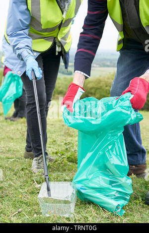 Close up of senior man helping son choose bow tie in store. Concept of ...