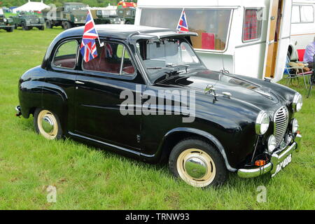 classic vintage black Austin A35 at classic car show driving on road ...