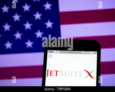 In this photo illustration the JetSuiteX logo is seen displayed on a ...