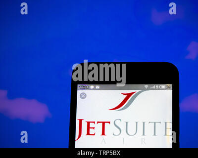 In this photo illustration the JetSuiteX logo is seen displayed on a ...