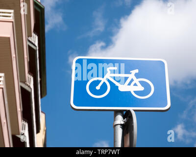 Bicycle path blue rectangular sign Stock Photo - Alamy