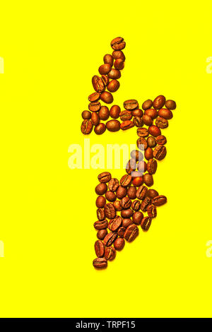 Isolated lightning shape made with coffee beans. Symbol of a superpower ...