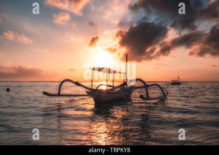 Ancient traditional Janggolan fishing boat on seashore at colorful ...