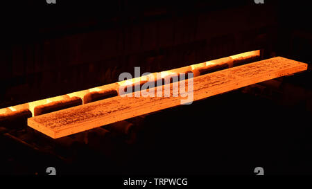 glowing brame in a steel mill - industrial factory for the production ...