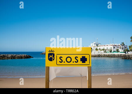 big text SOS on the sand of the beach in summer Stock Photo - Alamy