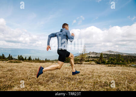 Runner cross country Stock Photo - Alamy