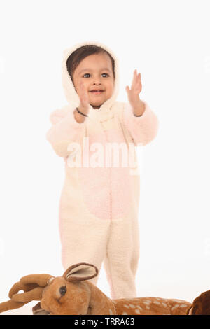 Baby boy standing and clapping hands Stock Photo - Alamy