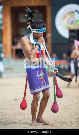 Tribal man playing traditional musical instrument Dholak or drums ...