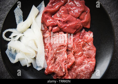 Set of meat beef slice liver and mushroom vegetables on white plate for ...