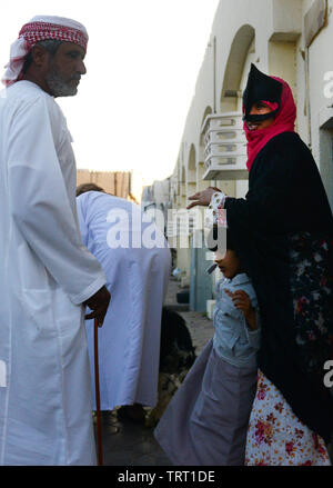An Omani Bedouin woman wearing a traditional Batoola face covering ...