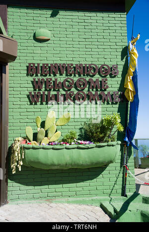 Welcome Sign with flower decoration on wooden background Stock Photo ...