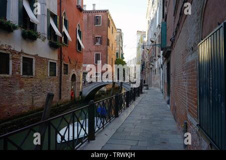 Morning view of a small canal with residential houses on the sides ...