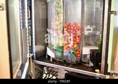Inside dispensers of Chowbotics Inc's Sally the Robot, a fresh salad ...