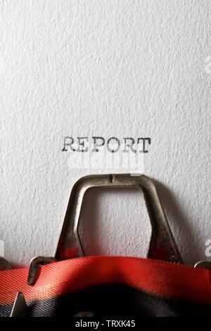 Report word written with a typewriter Stock Photo - Alamy
