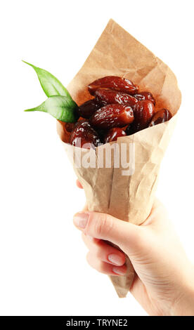 Dried dates in paper cone isolated on white Stock Photo - Alamy