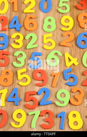 Colorful numbers on wooden background Stock Photo - Alamy
