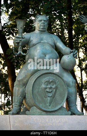 A bronze sculpture of a fat man Stock Photo - Alamy