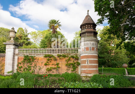 Octagonal old wooden Dovecote with tiled roof on top of round tower in ...