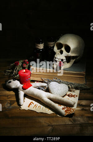 Voodoo Doll on a stone background with dramatic lighting. Mystic still ...