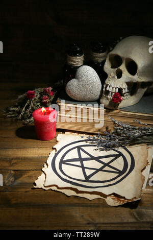 Conceptual photo of love magic. Composition with skull, voodoo doll ...