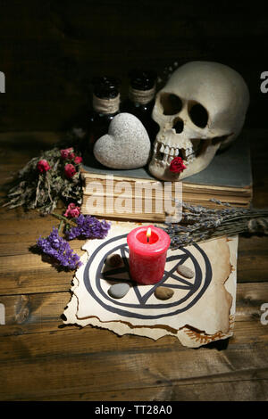 Conceptual photo of love magic. Composition with skull, voodoo doll ...
