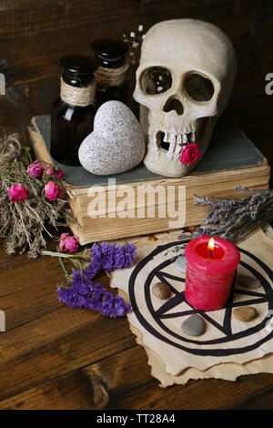 Conceptual photo of love magic. Composition with skull, voodoo doll ...
