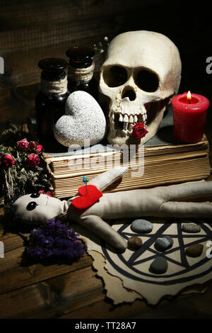 Voodoo Doll on a stone background with dramatic lighting. Mystic still ...