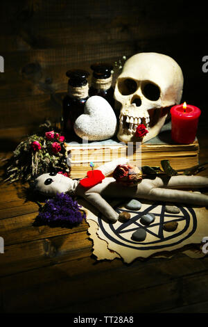 Voodoo Doll on a stone background with dramatic lighting. Mystic still ...