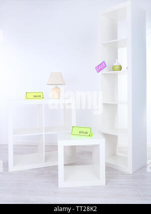 New white shelves with prices on light background Stock Photo - Alamy
