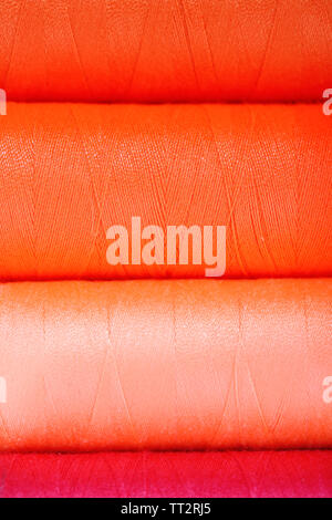 Multicolor sewing threads background Stock Photo - Alamy