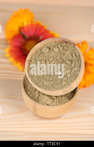 Dry henna powder in bowls on wooden table Stock Photo - Alamy