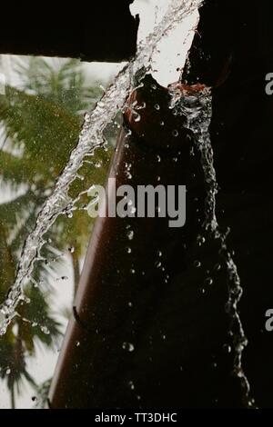 Water dripping from roof top on a rainy day Stock Photo - Alamy
