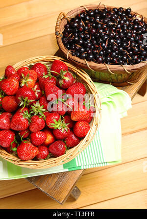 Fresh berries in baskets on white wall background Stock Photo - Alamy