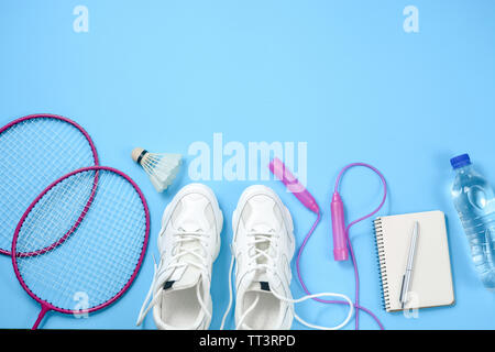 Fitness and healthy life concept. Sneakers, dumbbells and headphones on ...