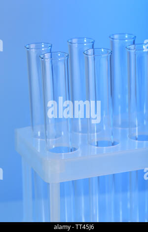 Empty test-tubes on blue background closeup Stock Photo - Alamy