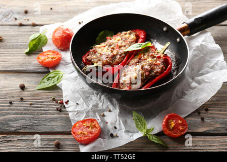 Delicious stuffed peppers in frying pan on table close-up Stock Photo ...