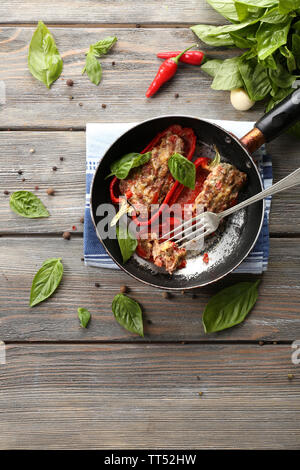 Delicious stuffed peppers in frying pan on table close-up Stock Photo ...