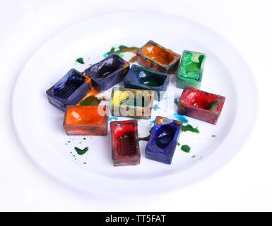 Watercolor paint cubes on plate isolated on white Stock Photo - Alamy