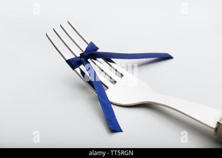 Stages of tying bow on fork close-up Stock Photo - Alamy