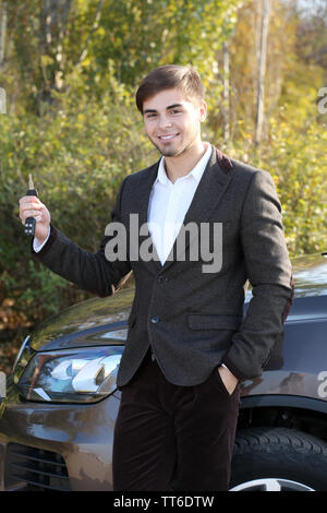 Male hand with car key outdoors Stock Photo - Alamy