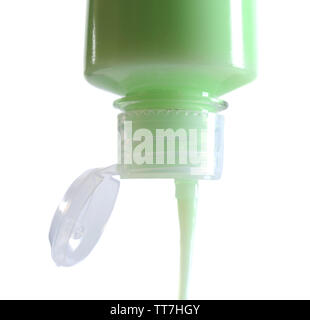 Cosmetic liquid pouring from bottle isolated on white Stock Photo - Alamy