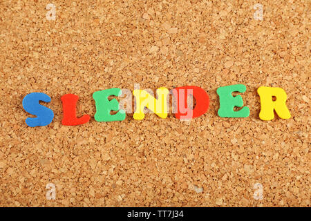 Slender word on cork board background Stock Photo - Alamy