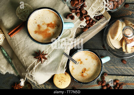 Beautiful composition with tasty cappuccino on wooden table Stock Photo ...