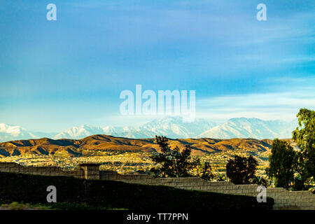Big clouds above snow capped peaks of mountains in the italian Alps ...