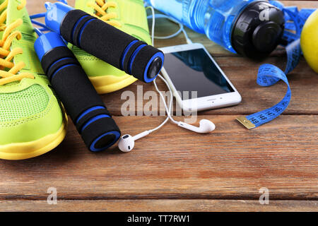 Different tools for sport on wooden background Stock Photo - Alamy