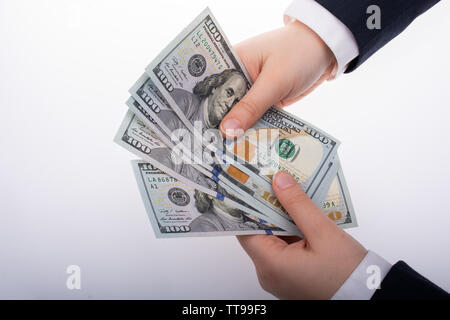 Businessman holding US dollar banknote money on white background Stock ...